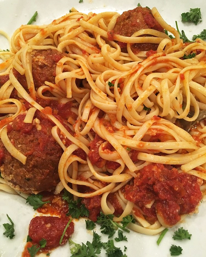 Spaghetti and meatballs that would make any Italian grandmother nod approvingly while secretly taking notes on the sauce.