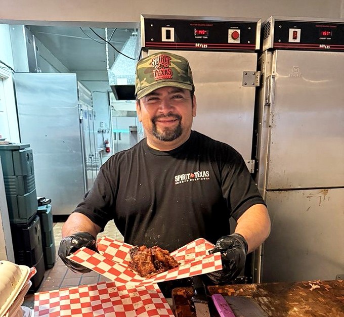 The look of a pitmaster who knows his brisket is about to change someone's life. That thumbs up isn't confidence&mdash;it's a guarantee.