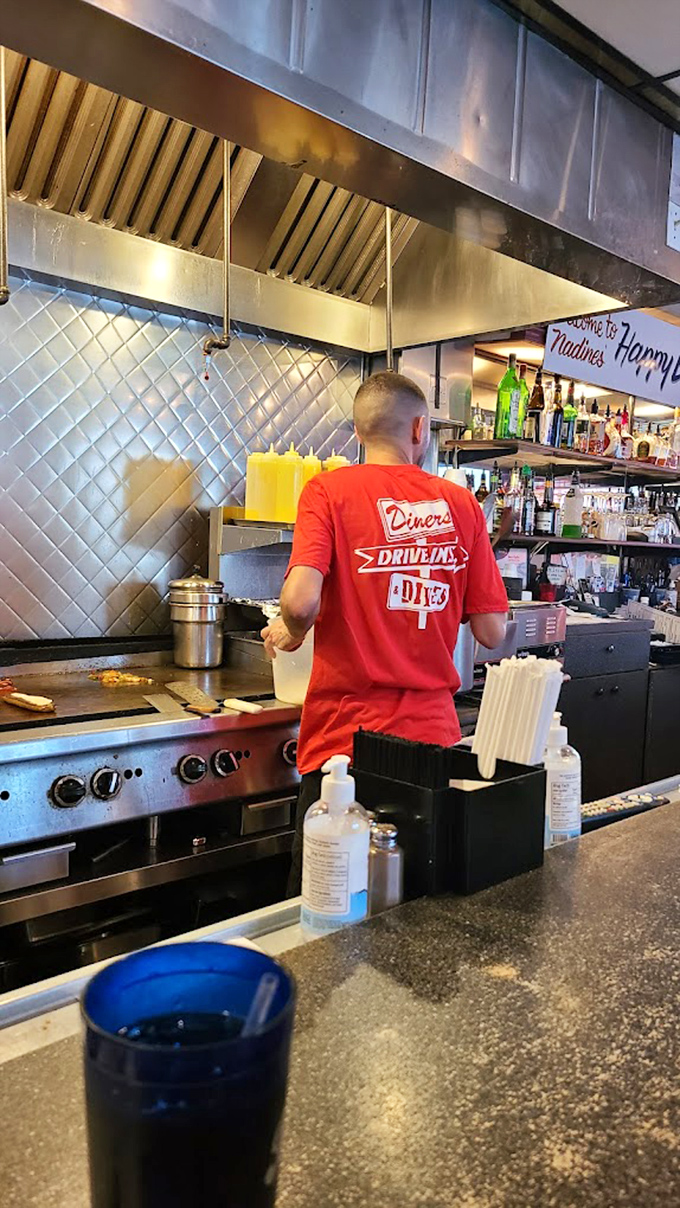 Cooks in their element, working the grill with the confidence that comes only from making the same perfect dishes for years.