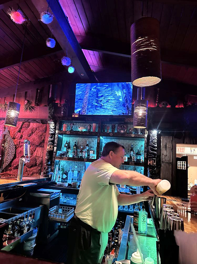 Skilled bartenders demonstrate genuine passion for tiki craft, taking time to perfect each elaborate cocktail presentation.