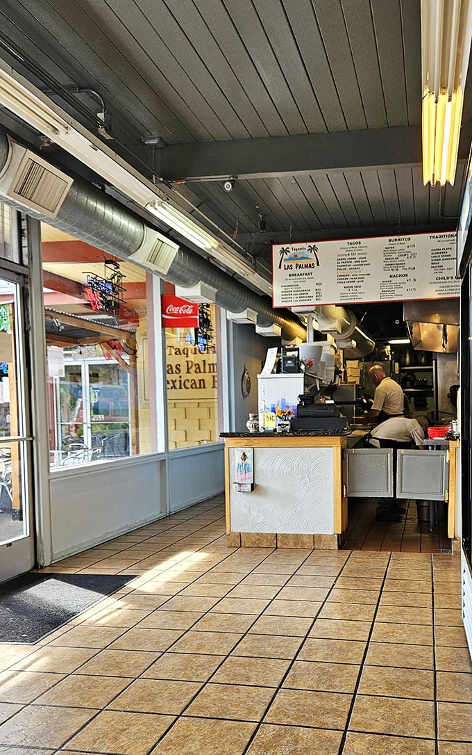 The heart of Las Palmas&mdash;where orders are taken and culinary dreams fulfilled. That menu board overhead isn't just a list; it's a roadmap to satisfaction.