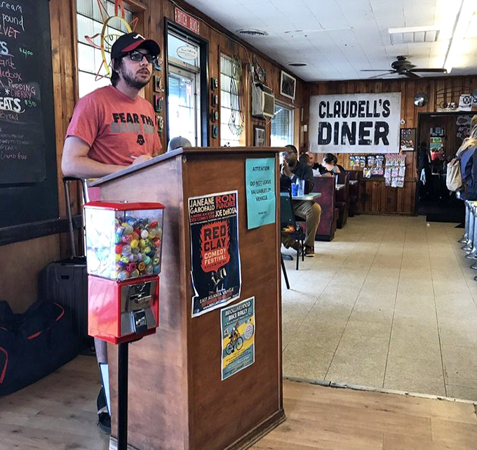 The gumball machine stands sentinel by the host stand, promising sweet rewards after savory indulgences.