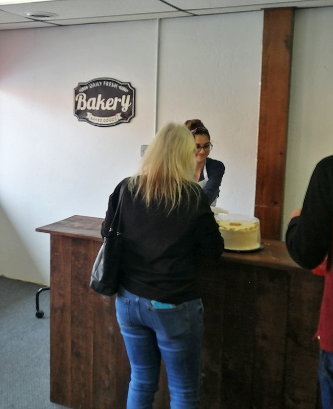 Friendly staff members embody the genuine warmth that transforms a simple bakery visit into a memorable community experience.