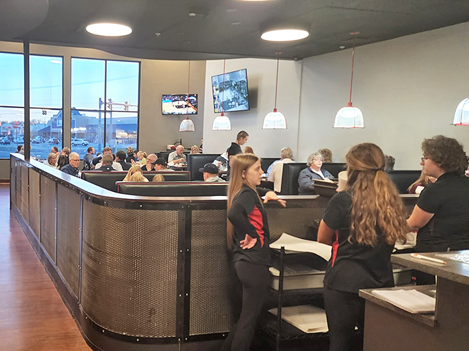 A bustling dining room filled with servers who move with practiced efficiency&mdash;the choreographed dance of a well-run restaurant in full swing.