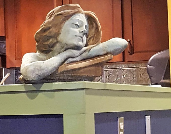 Even the decorative touches have personality here, watching over diners with artistic charm and whimsical grace.