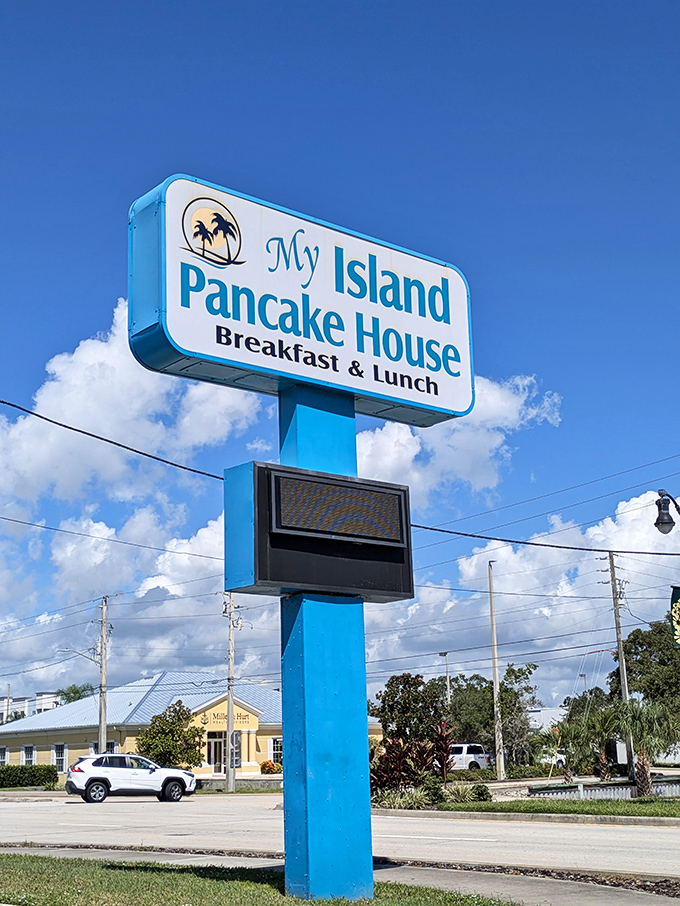 The iconic sign stands tall against Florida's impossibly blue sky, a beacon of breakfast hope for hungry travelers and locals alike.