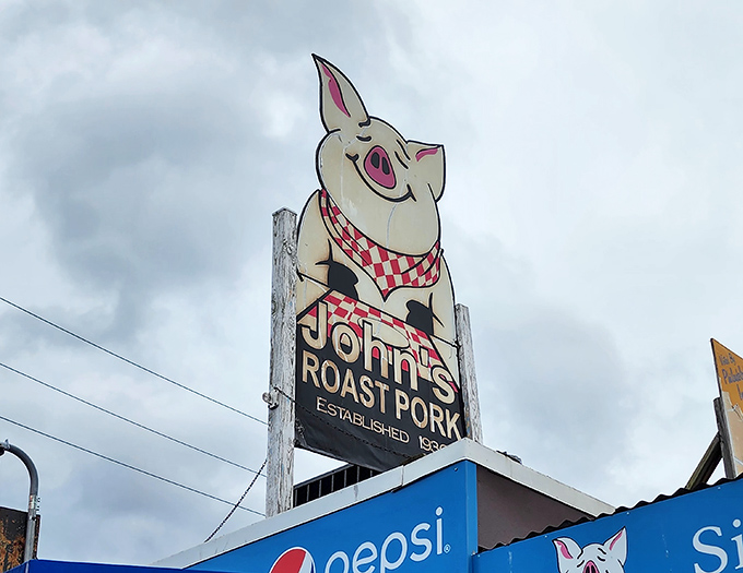That smiling pig sign has witnessed decades of sandwich pilgrimages and still grins knowingly at first-timers about to have their minds blown.