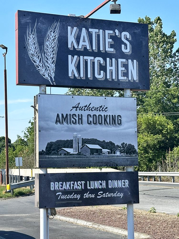 The roadside sign stands as a beacon to hungry travelers, wheat stalks symbolizing the simple, hearty fare that awaits inside.