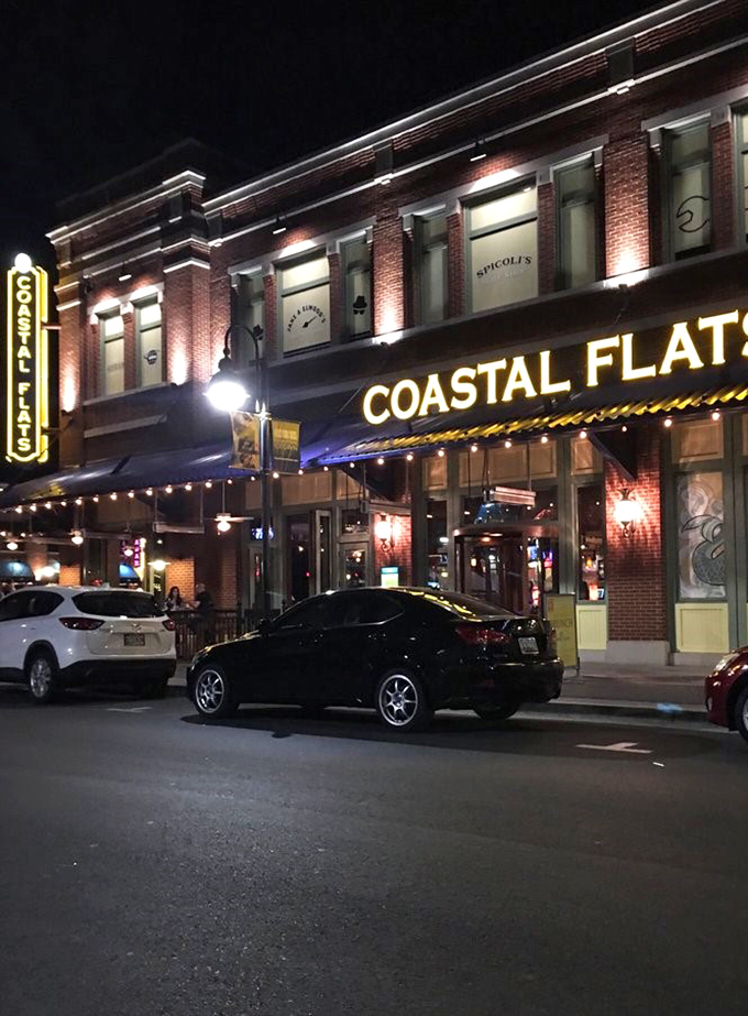 Even at night, Coastal Flats' illuminated signage serves as a lighthouse guiding hungry souls to seafood nirvana.