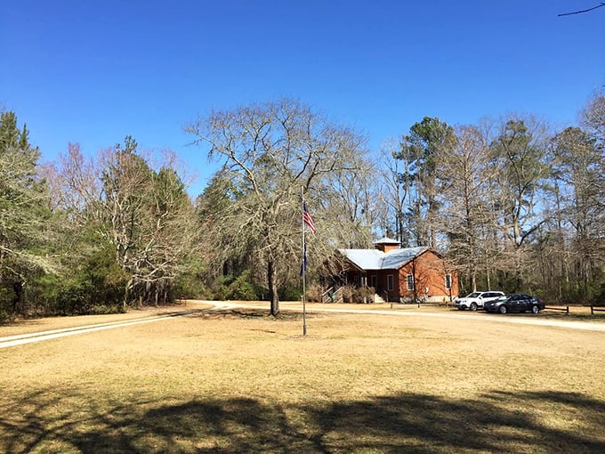 The visitor center stands sentinel at the park's entrance, a humble guardian of this ecological treasure.