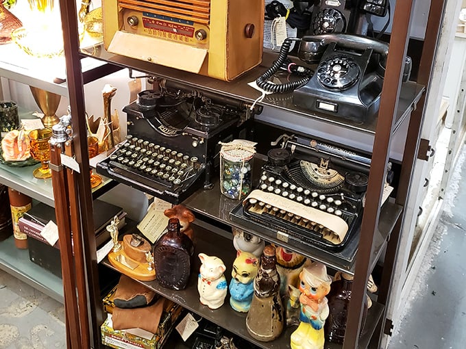 The typewriter collection sits alongside vintage phones and ceramic figurines &ndash; communication devices and conversation pieces from simpler times.