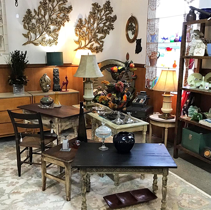 This booth feels like walking into your stylish great-aunt's living room—if your great-aunt had impeccable taste in mid-century furniture and decorative trees.