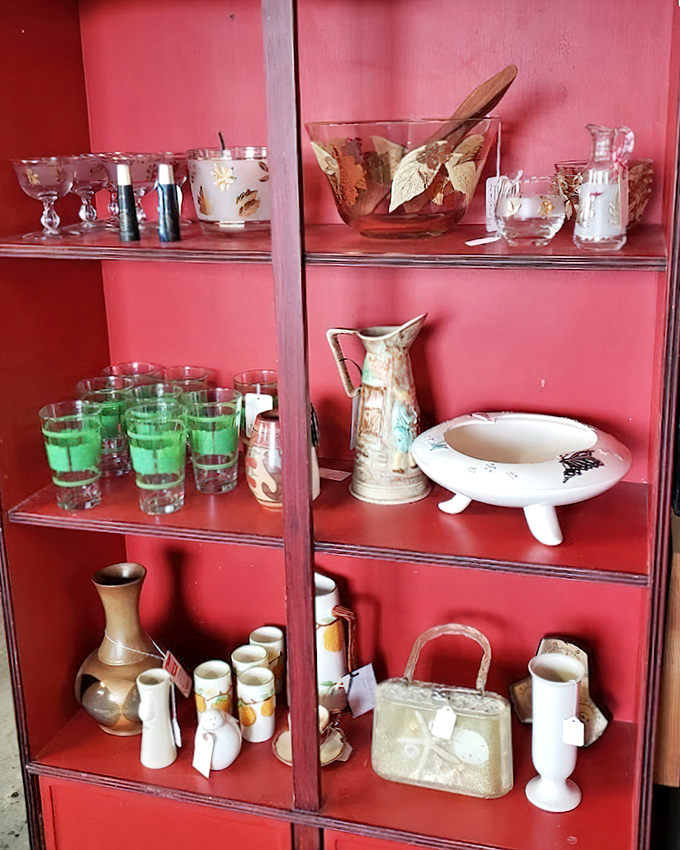 Mid-century kitchenware displayed against coral shelving creates a time portal to when avocado green was the height of kitchen fashion.
