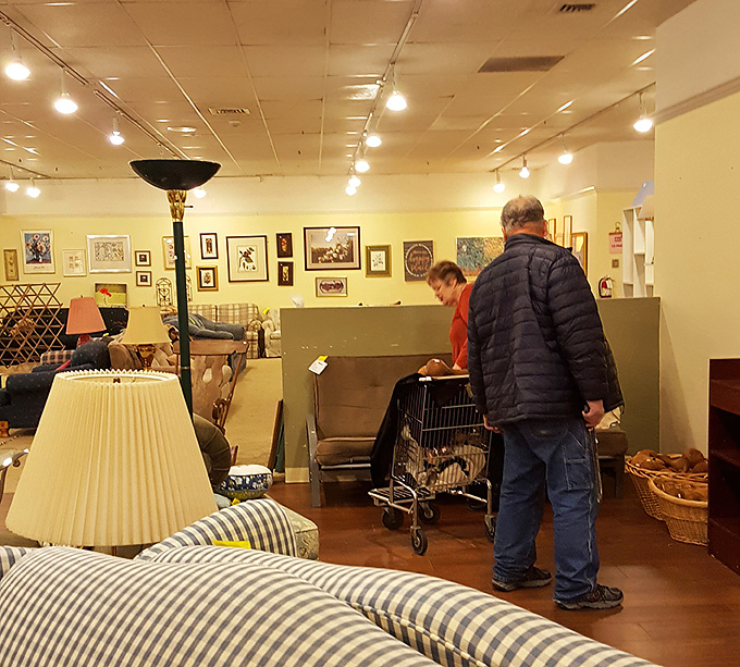 Serious shoppers navigate the furniture section with the focus of archaeologists, hunting for that perfect piece to complete their home.