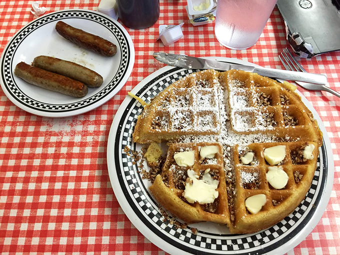 A waffle and sausage duet that sings in perfect harmony. The powdered sugar snowfall completes this breakfast symphony.