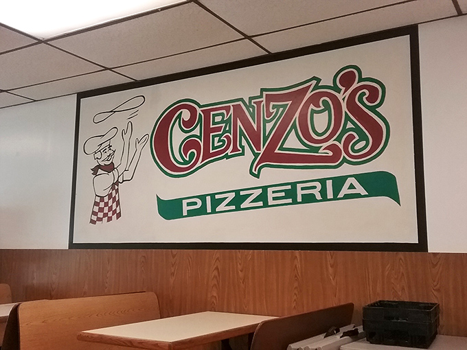 The iconic Cenzo's wall sign watches over diners like a benevolent pizza deity, promising good things to those who order wisely.