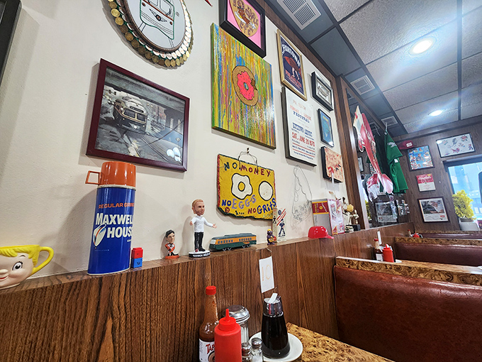 Every inch of wall space tells a story—from vintage ads to local memorabilia—creating a museum of everyday Philadelphia life.