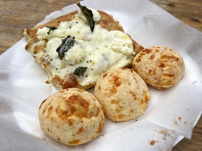 Those cheese-filled dough balls are the supporting actors who steal the show. The white pizza slice looks ethereal, like the ghost of pizzas past.