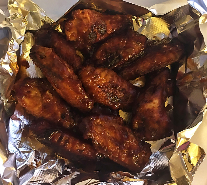 Wings that don't play second fiddle to the pizza&mdash;these glistening beauties demand their own standing ovation and extra napkins.