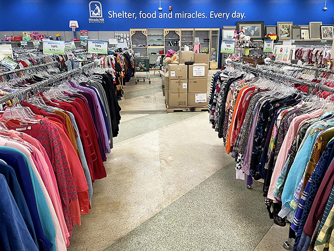"Shelter, food and miracles. Every day." The mission statement hangs above a rainbow of possibilities – each garment waiting for its second act.