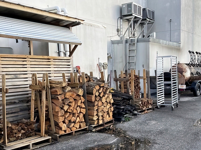 Stacks of wood waiting for their moment of glory. Every great BBQ story begins with these humble logs and ends with a satisfied smile.