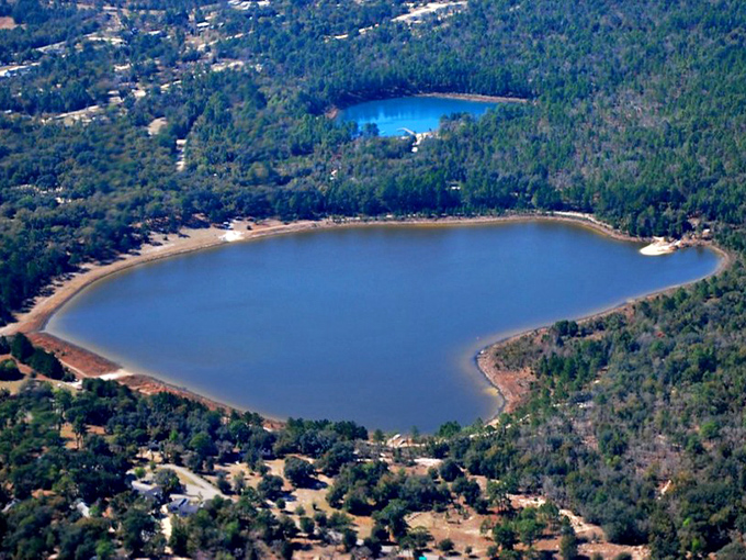 Nature's perfect mirror! Keystone Heights' twin lakes reflect the Florida sky like giant sapphires nestled in emerald forests.