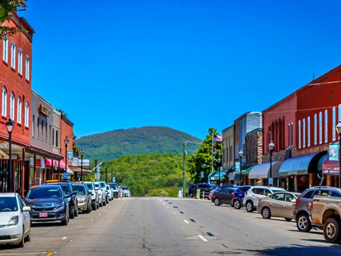 The Blue Ridge Mountains stand sentinel over Franklin's colorful downtown, where every storefront tells a story.
