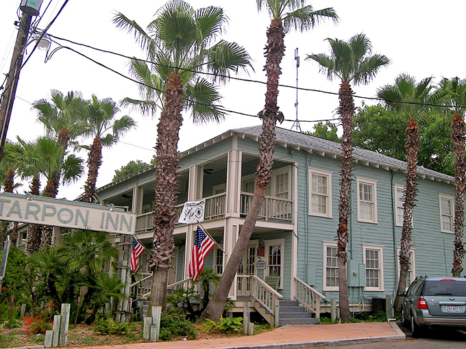 The Tarpon Inn stands as Port A's teal sentinel, welcoming visitors to island time since before "island time" was a thing.