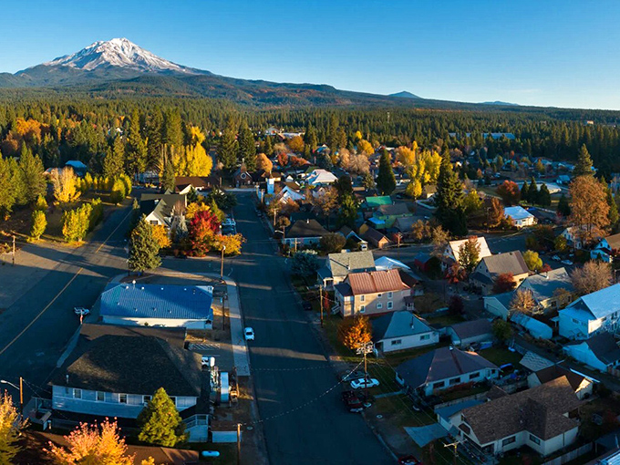 From above, McCloud reveals itself as a perfect grid of small-town life, nestled among autumn-painted trees with Mount Shasta standing eternal watch.
