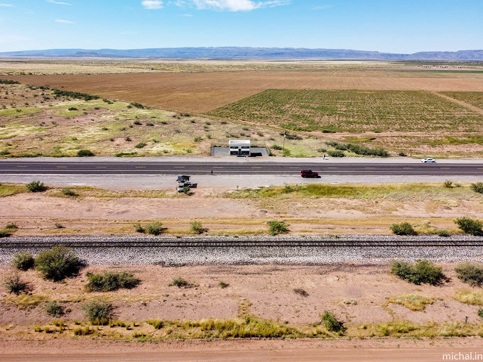 From this height, Prada Marfa appears as a tiny white dot&mdash;a minimalist punctuation mark on the run-on sentence of the Texas landscape.
