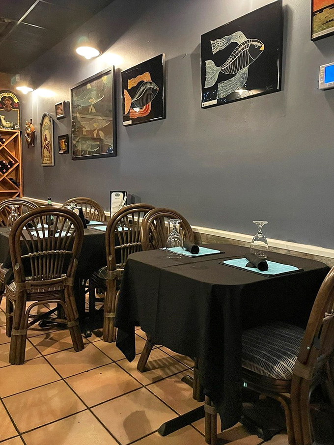 Minimalist table settings against dark walls let the food be the star, while fish skeleton artwork adds just the right touch of oceanic whimsy.