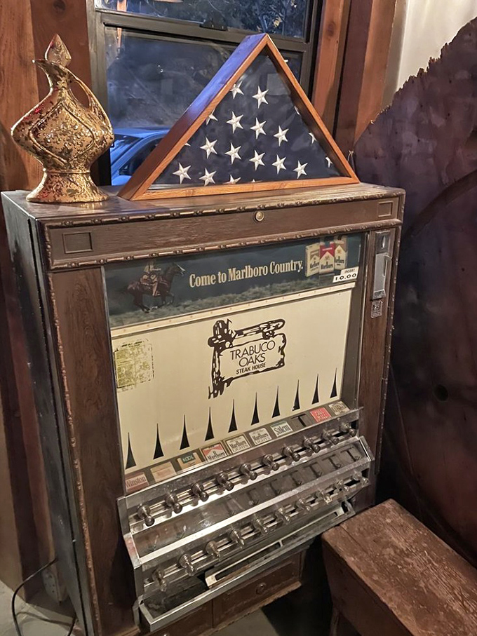 An antique cigarette machine that's now purely decorative, reminding us how dining experiences have evolved beautifully.