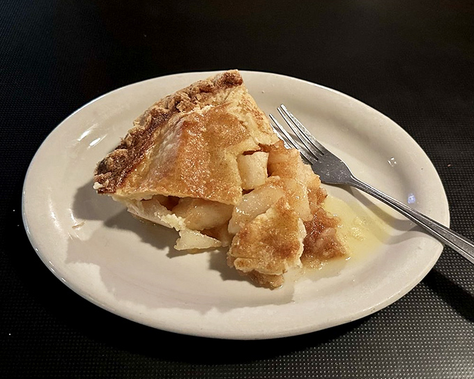 Apple pie that doesn't need to announce itself as homemade &ndash; the golden crust and generous filling speak volumes without saying a word.
