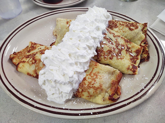 Crepes that make you feel like you're having a sophisticated European breakfast while sitting in a cozy Illinois diner. The whipped cream mountain says "no regrets."