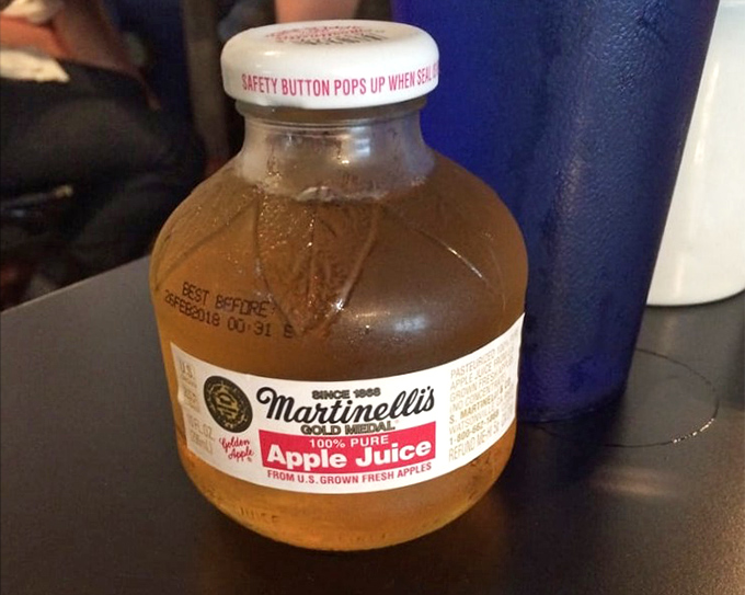 Martinelli's apple juice in those iconic little bottles—proof that sometimes the best things come in small packages. Nostalgia you can actually taste.