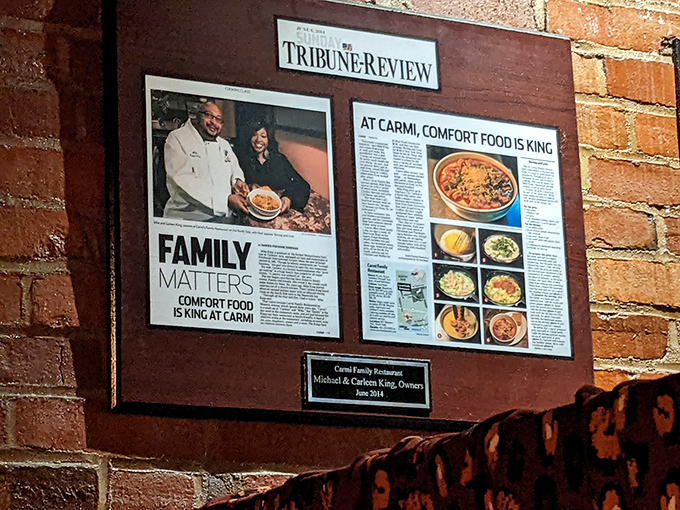 The framed newspaper articles tell the story: Carmi isn't just a restaurant&mdash;it's a family legacy where comfort food reigns supreme.