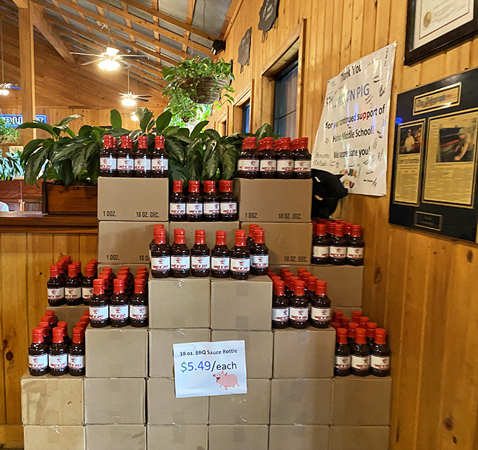 Their signature sauce, stacked like liquid treasure. The architectural display is almost as impressive as what's inside those bottles.