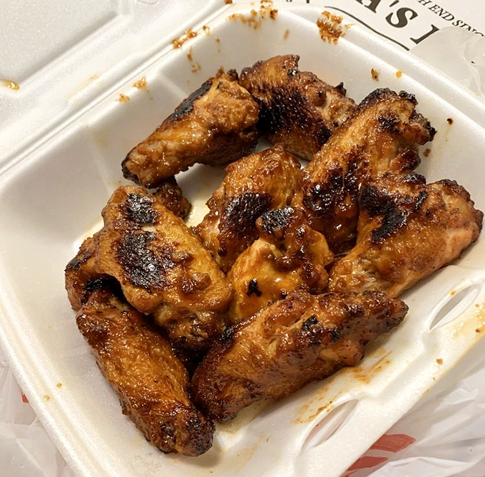 Wings that don't play second fiddle to pizza. These crispy, caramelized beauties deserve their own spotlight and fan club.