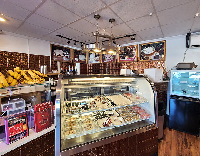 Sweet temptations behind glass&mdash;this little bakery counter offers a sugar break for weary shoppers hunting through the market's endless treasures.