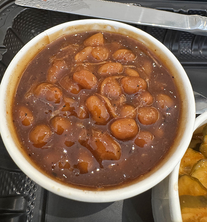 Baked beans swimming with bits of meat&mdash;not just a side dish, but a supporting actor worthy of its own award.