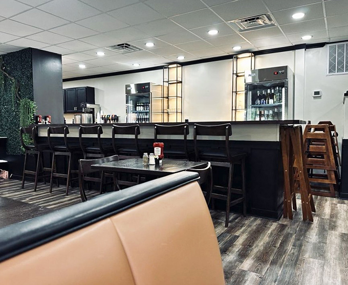 The bar area beckons with promises of perfectly mixed drinks and the possibility of making new friends while waiting for your table.