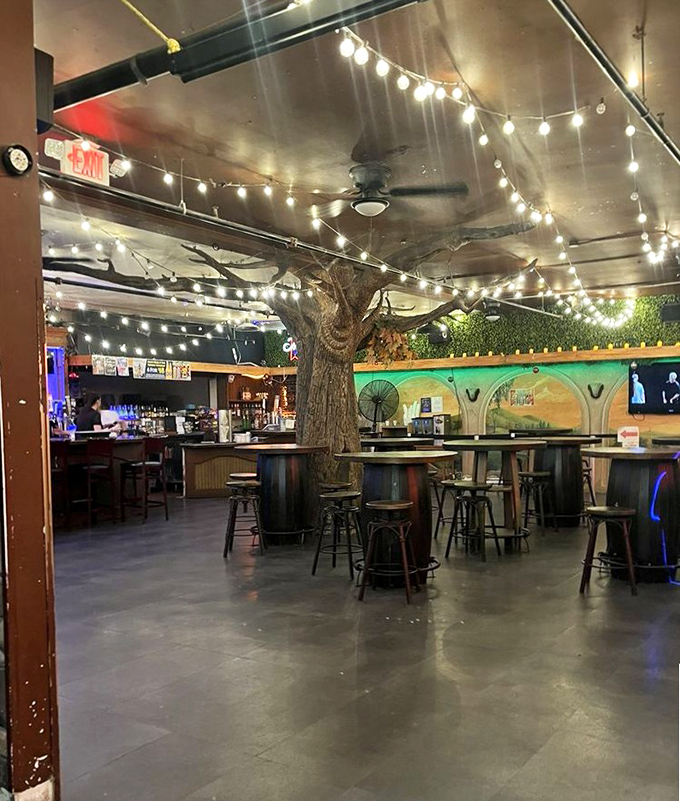 Wait, is this still the antique store? This atmospheric bar area with its fairy lights and tree centerpiece offers shoppers a different kind of spirit.
