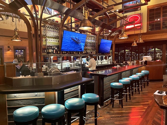 Turquoise bar stools pop against rich wood tones, inviting you to perch and watch the bartenders work their magic.