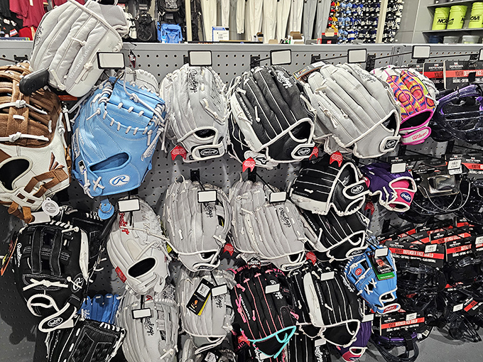 Baseball gloves waiting for their forever hands. In Florida, where summer never truly ends, sporting goods remain in season year-round.