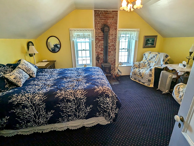 The keeper's bedroom&mdash;cozy, practical, and with a view worth more than any five-star hotel. Yellow walls to brighten foggy mornings.