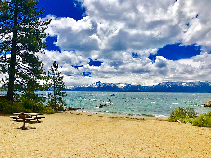 Beach picnics taste better with a side of panoramic mountain views. That sandwich you packed just became the second-most impressive thing around.