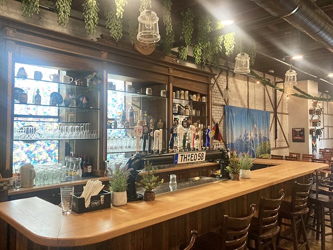 The second bar space feels like a secret Alpine hideaway, with hanging plants and lanterns creating an atmosphere where "just one more beer" becomes inevitable.