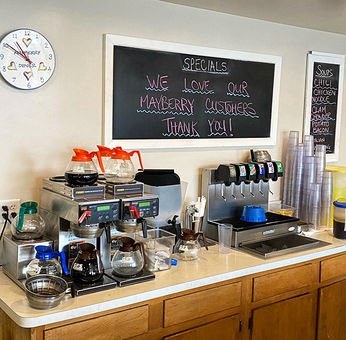 The coffee station&mdash;command central for Mayberry's morning operations. That chalkboard message isn't just words; it's the diner's heartbeat written in chalk.