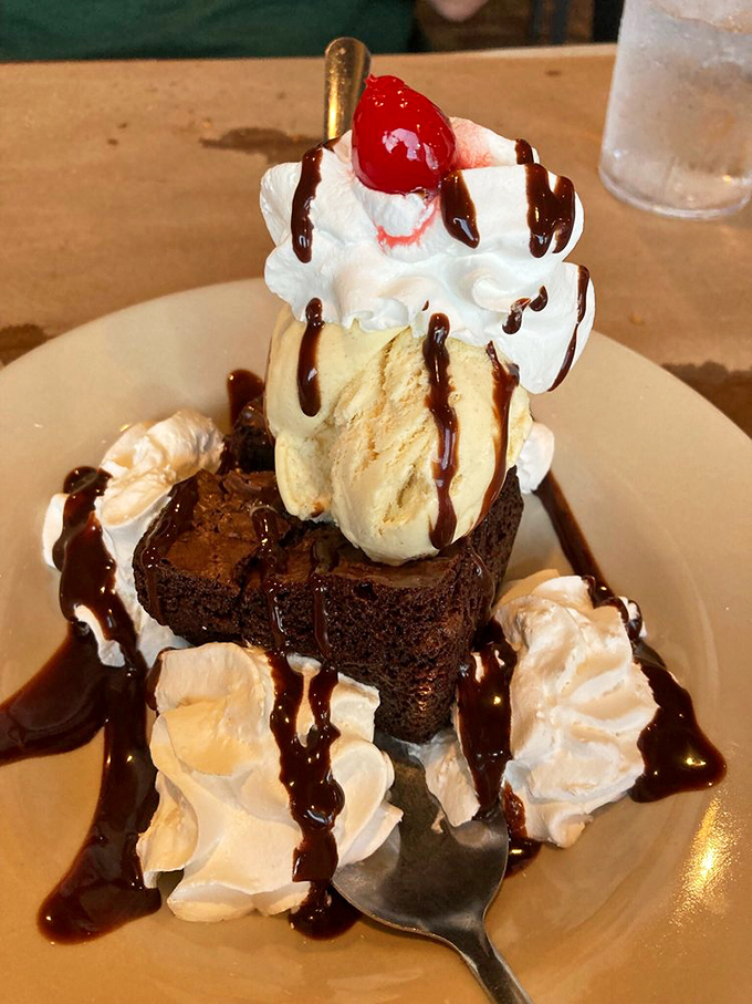 This isn't just dessert—it's the grand finale. A brownie sundae with enough whipped cream to make you forget you just ate your weight in ribs.
