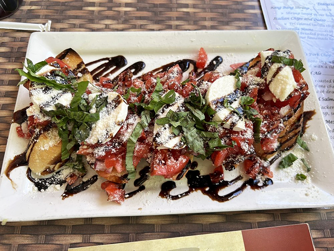 Bruschetta that's dressed better than most people at a wedding&mdash;fresh tomatoes, herbs, and balsamic creating a flavor explosion.